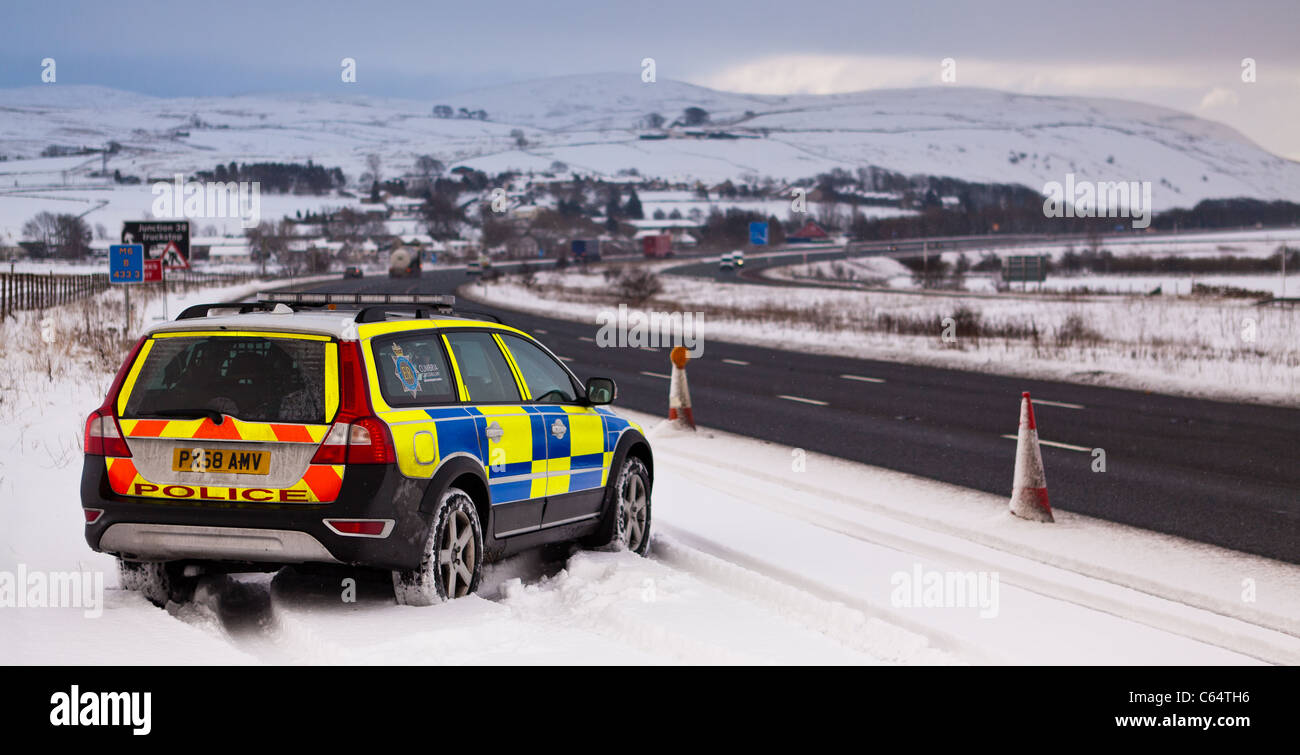 Police vehicle on Motorway patrol in winter snow. UK Stock Photo - Alamy