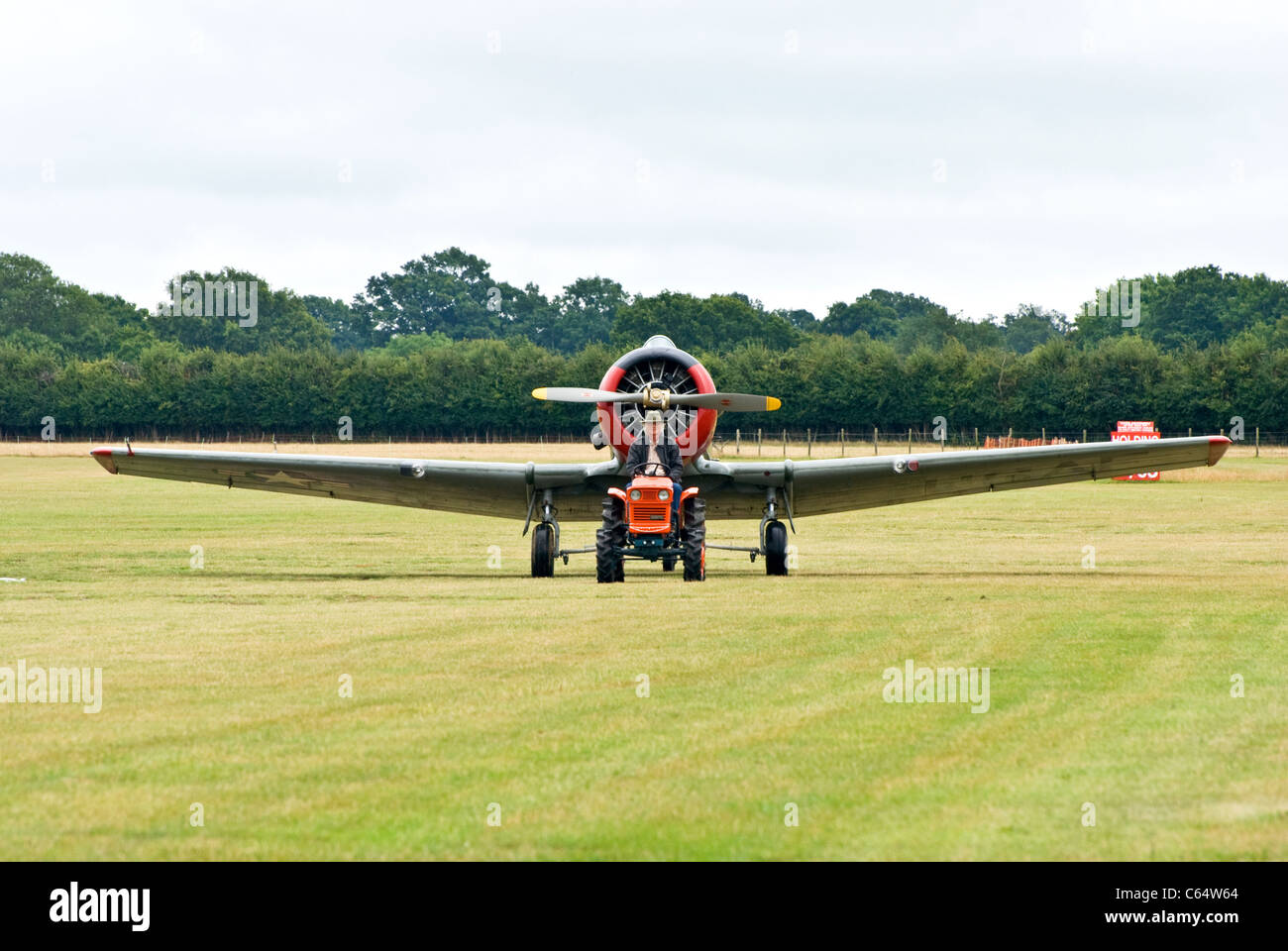 Tractor pulling a Harvard Texan T-6G airplane Stock Photo - Alamy