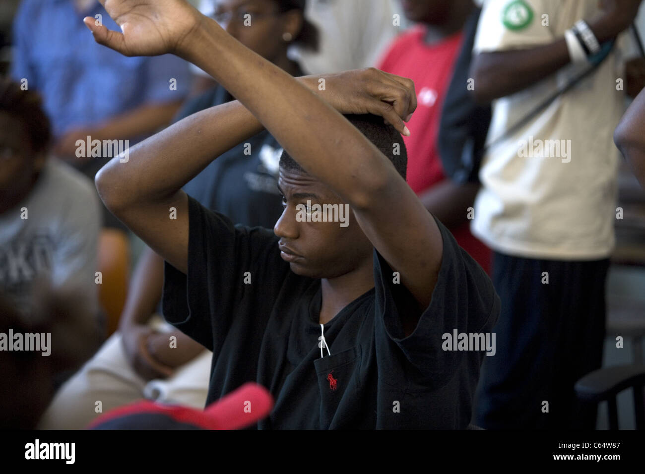 Students from the Detroit Community School participate in a ...