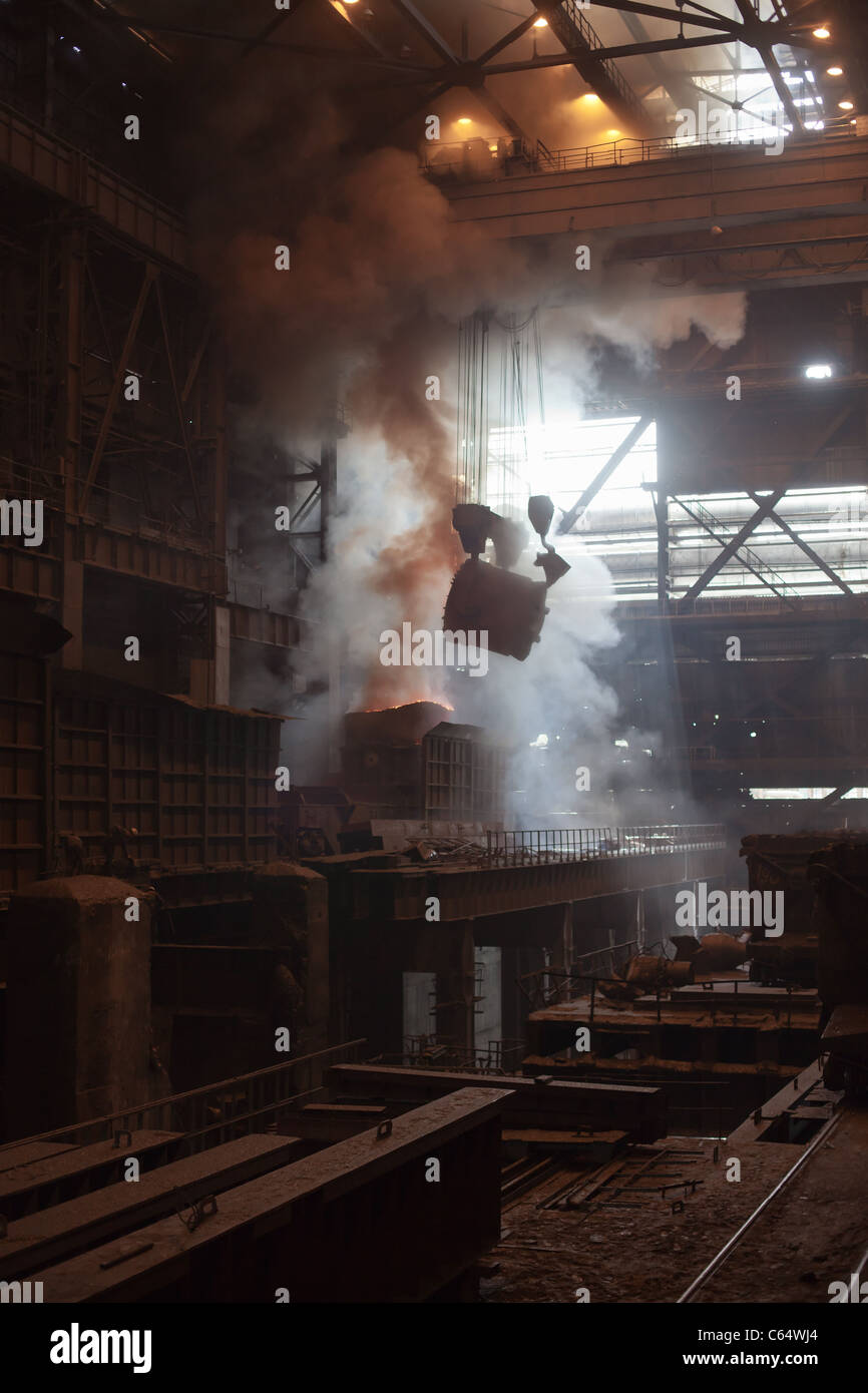 Production of cast iron in steel mills. Smelting metal in a ...