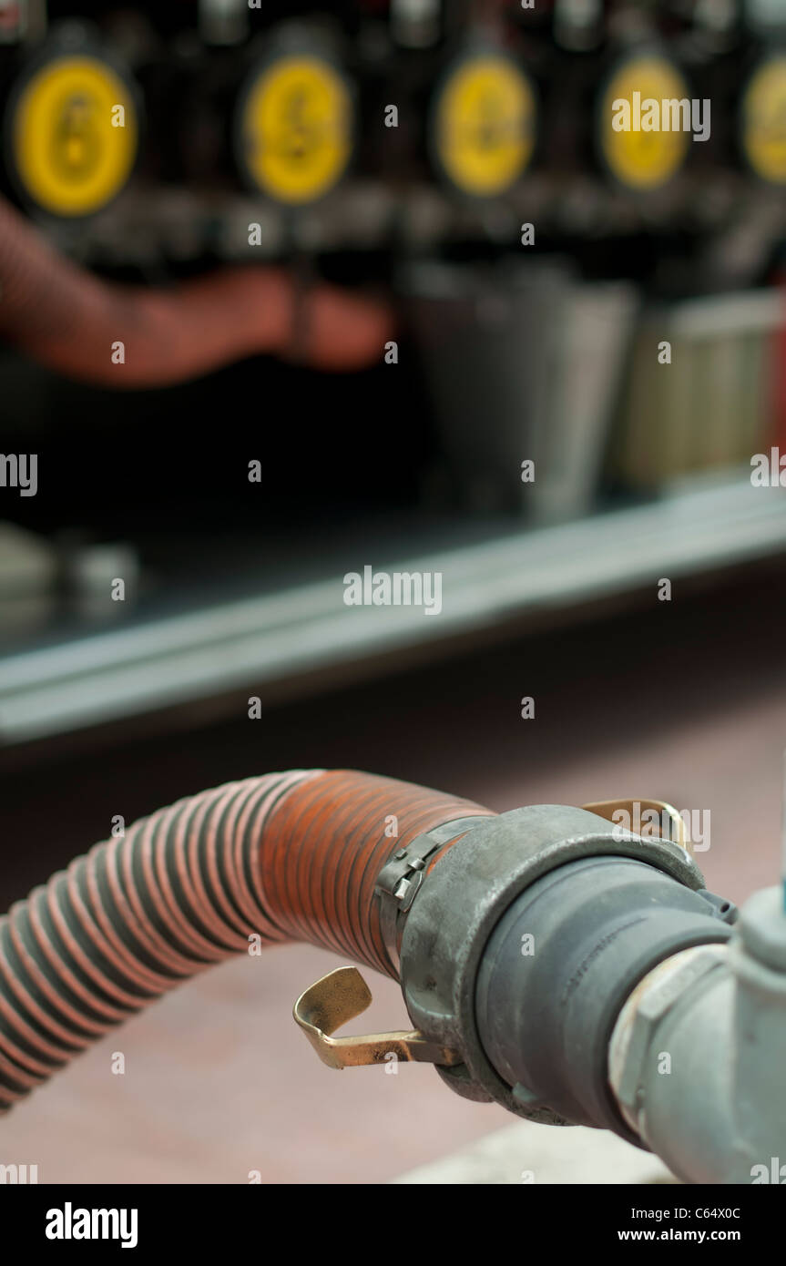 Fuel truck which refill. Hose close up and pumps to load the truck ...