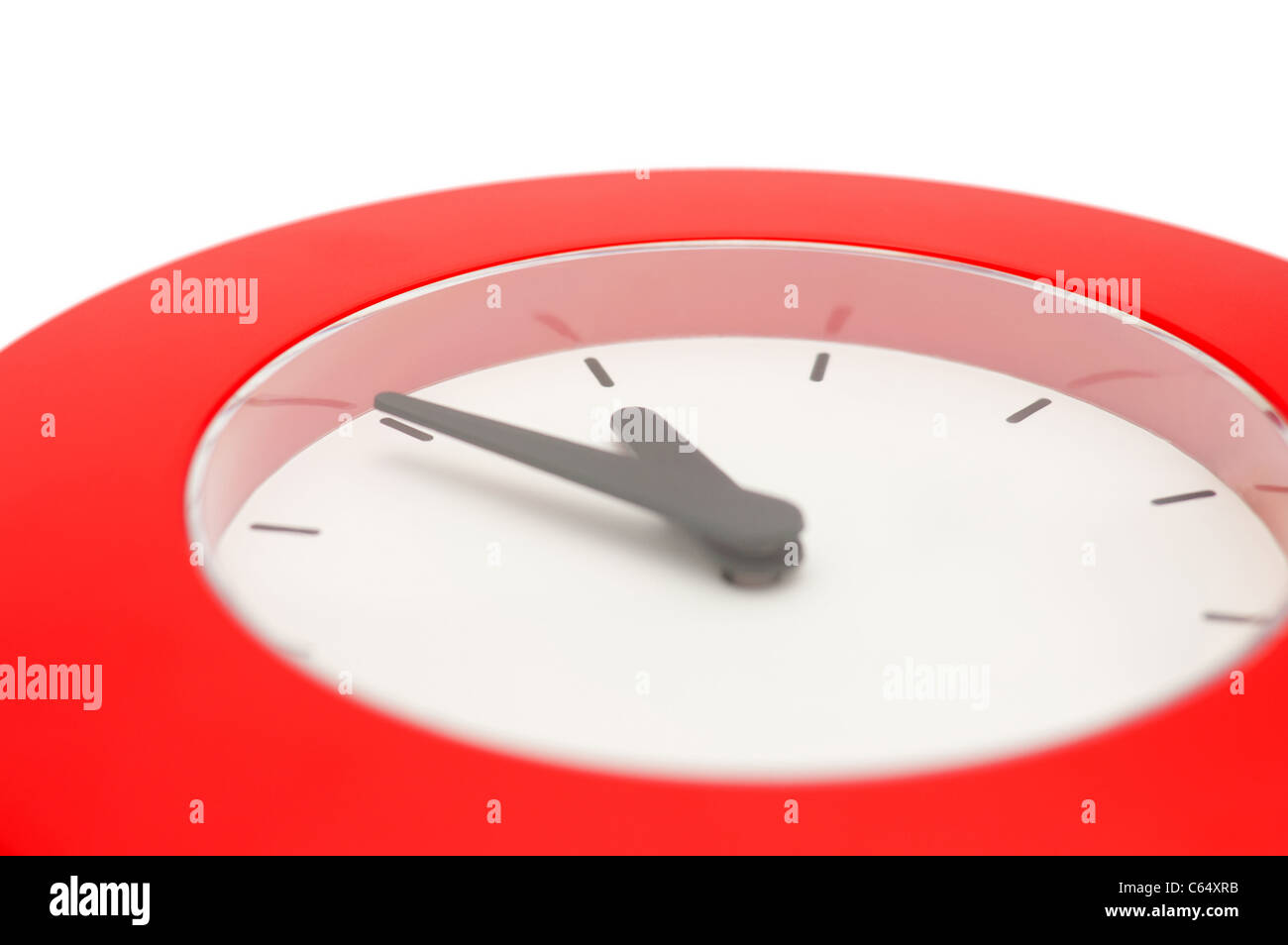 Detail of Red Wall Clock Showing Five To Midnight - Isolated on White ...