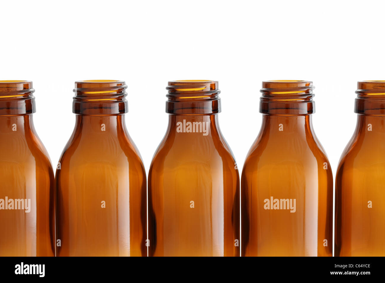 Brown glass bottles isolated on white background Stock Photo - Alamy