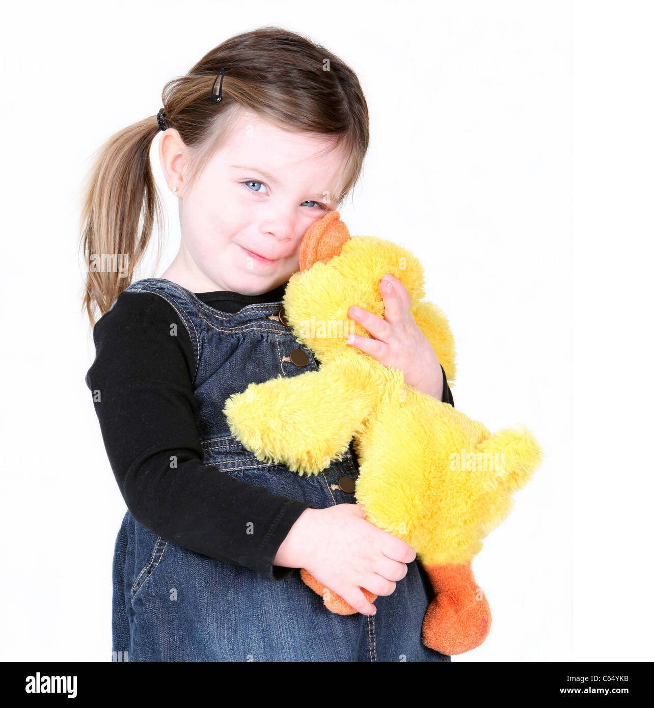 Little girl hugging her stuffed toy on white Stock Photo - Alamy