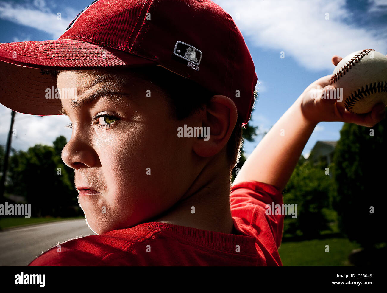 Caucasian boy throwing baseball-closeup Stock Photo - Alamy
