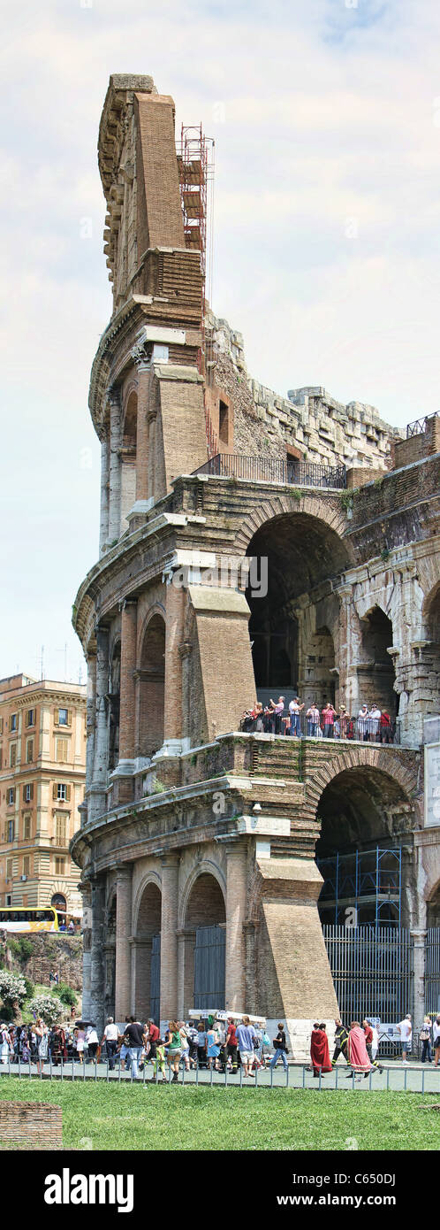 Rome Colosseum tourists across lawn park with tourists visiting the ...