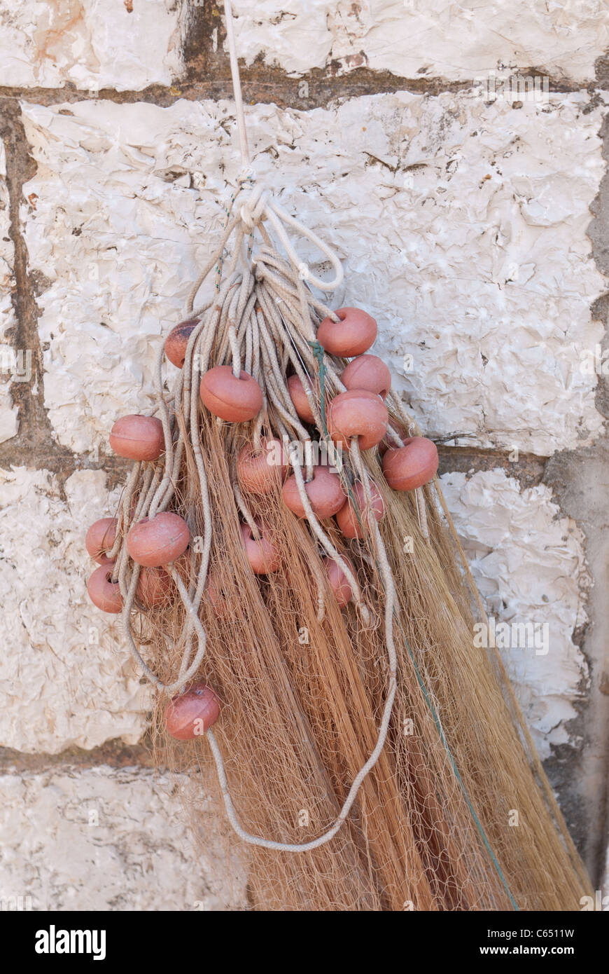 a macro of a fishing net hanging in the sun to dry Stock Photo - Alamy