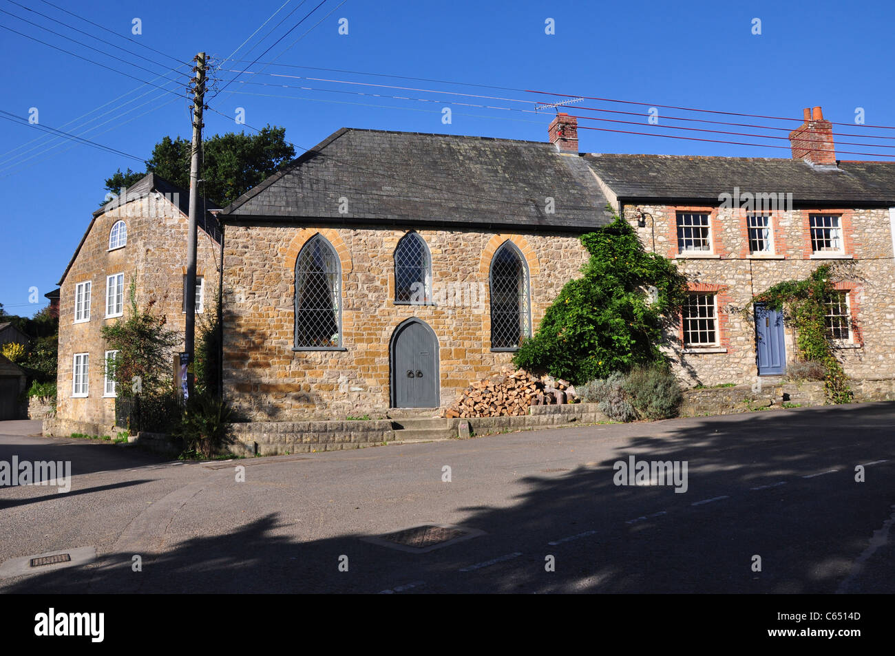 A traditional rural village with stone and slate cottages in Netherbury ...