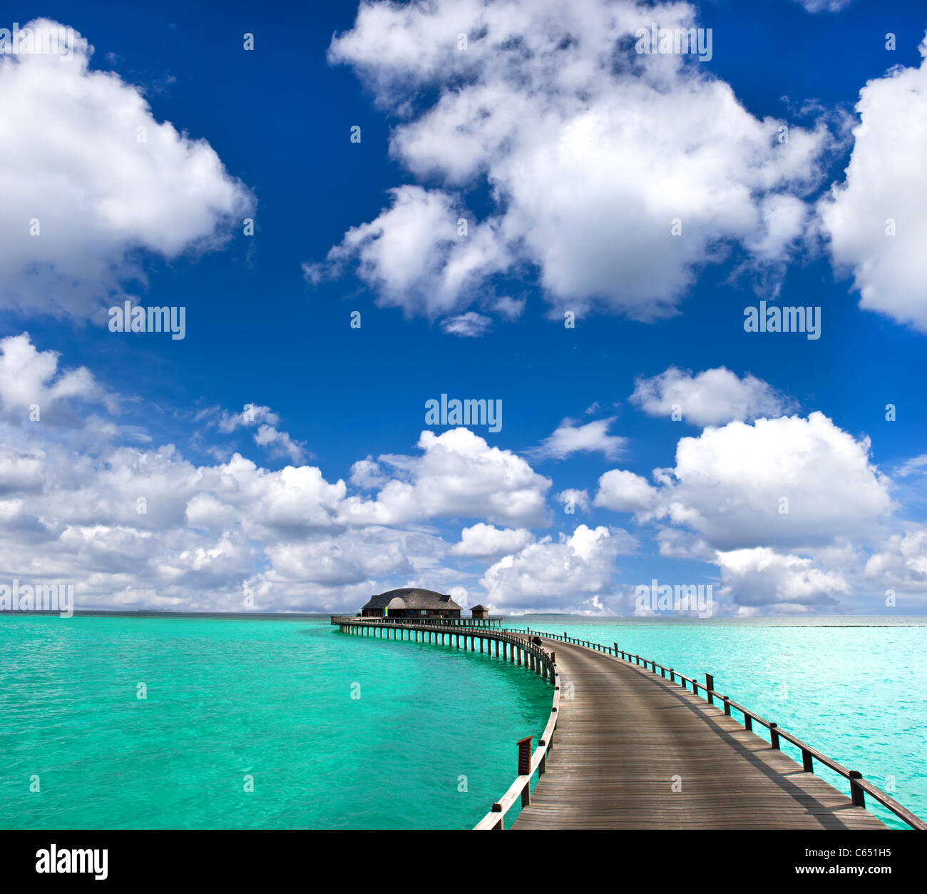 tropical seascape. overwater bungalow. blue sky Stock Photo - Alamy