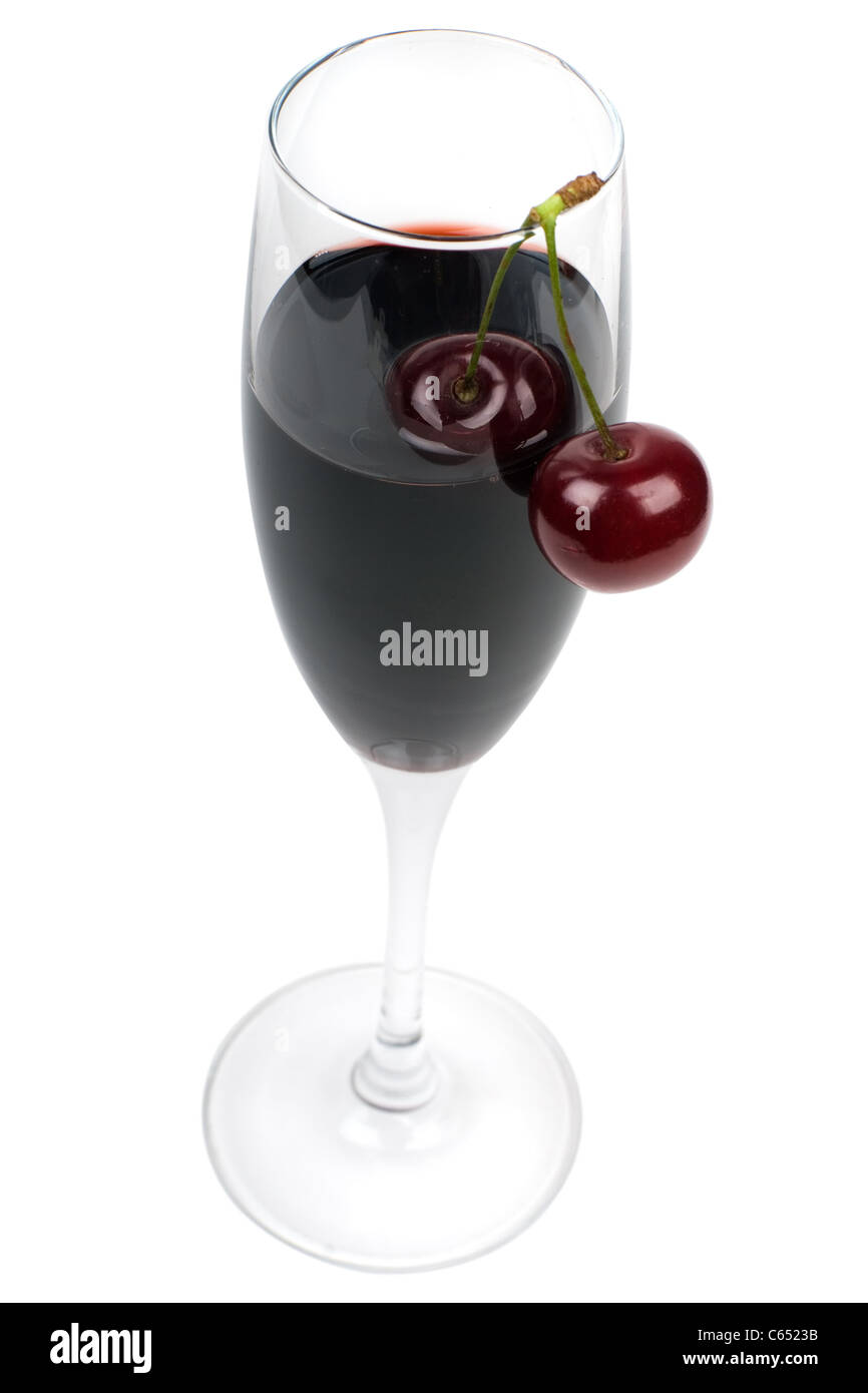Glass of wine and fresh cherries it is isolated on a white background ...