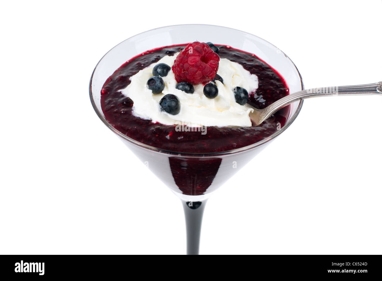 Huckleberry cocktail with whipped cream it is isolated on a white ...