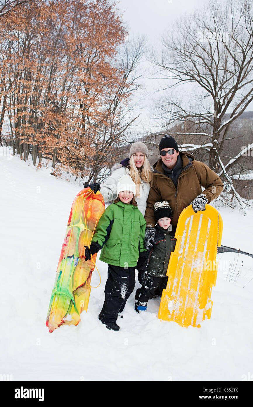 Portrait of family in snow Stock Photo - Alamy