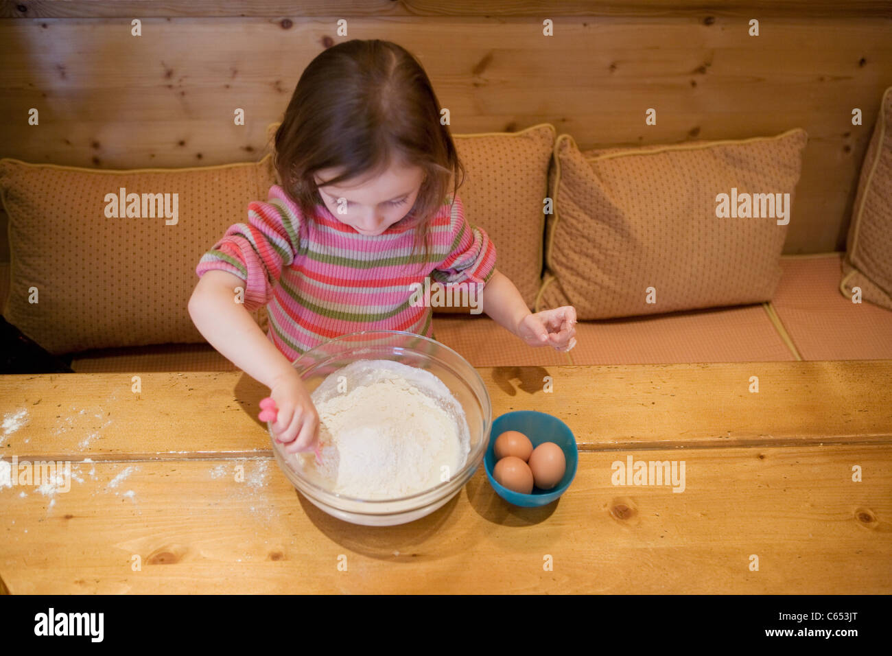 Young girl making cake Stock Photo - Alamy