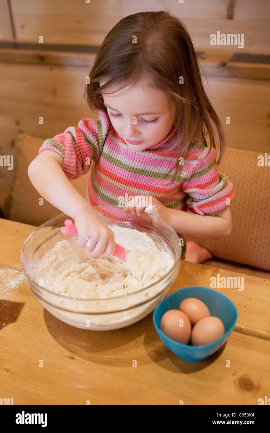 Young girl making cake Stock Photo - Alamy
