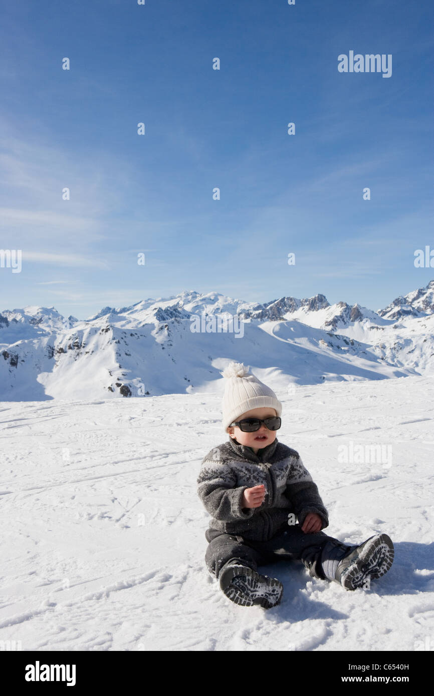 Cute toddler sitting on gray hi-res stock photography and images - Alamy