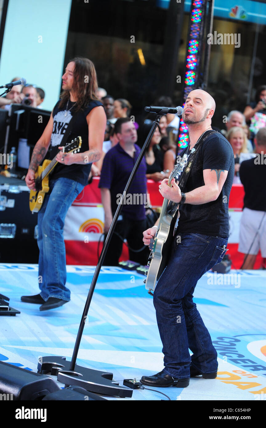 Singing performing on stage playing guitar full length hi-res stock ...