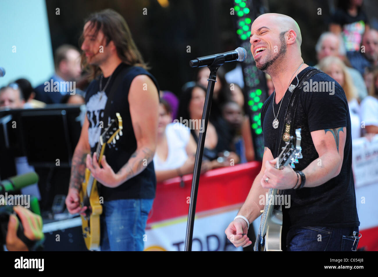 Singing performing on stage playing guitar half length hi-res stock ...