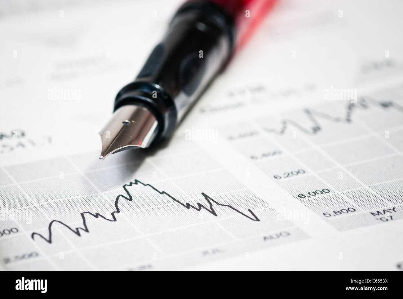 Business concept The calculator, pen and diagram Stock Photo - Alamy