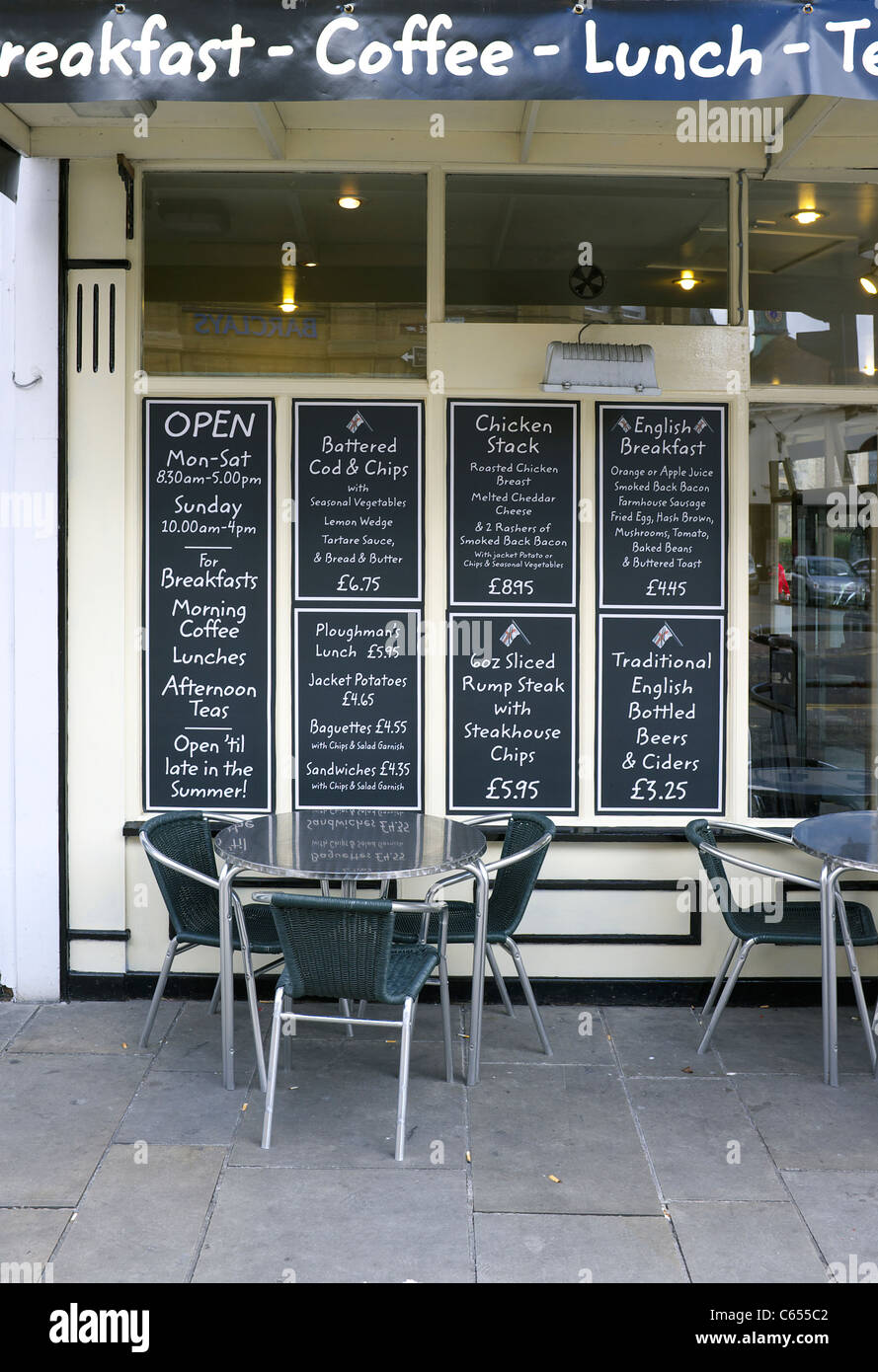 Menu boards and tables outside a cafe Stock Photo - Alamy