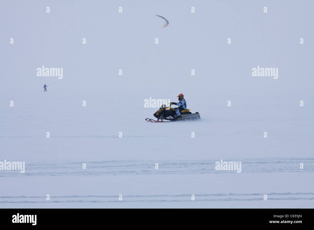 Snowmobile on a frozen lake Stock Photo - Alamy