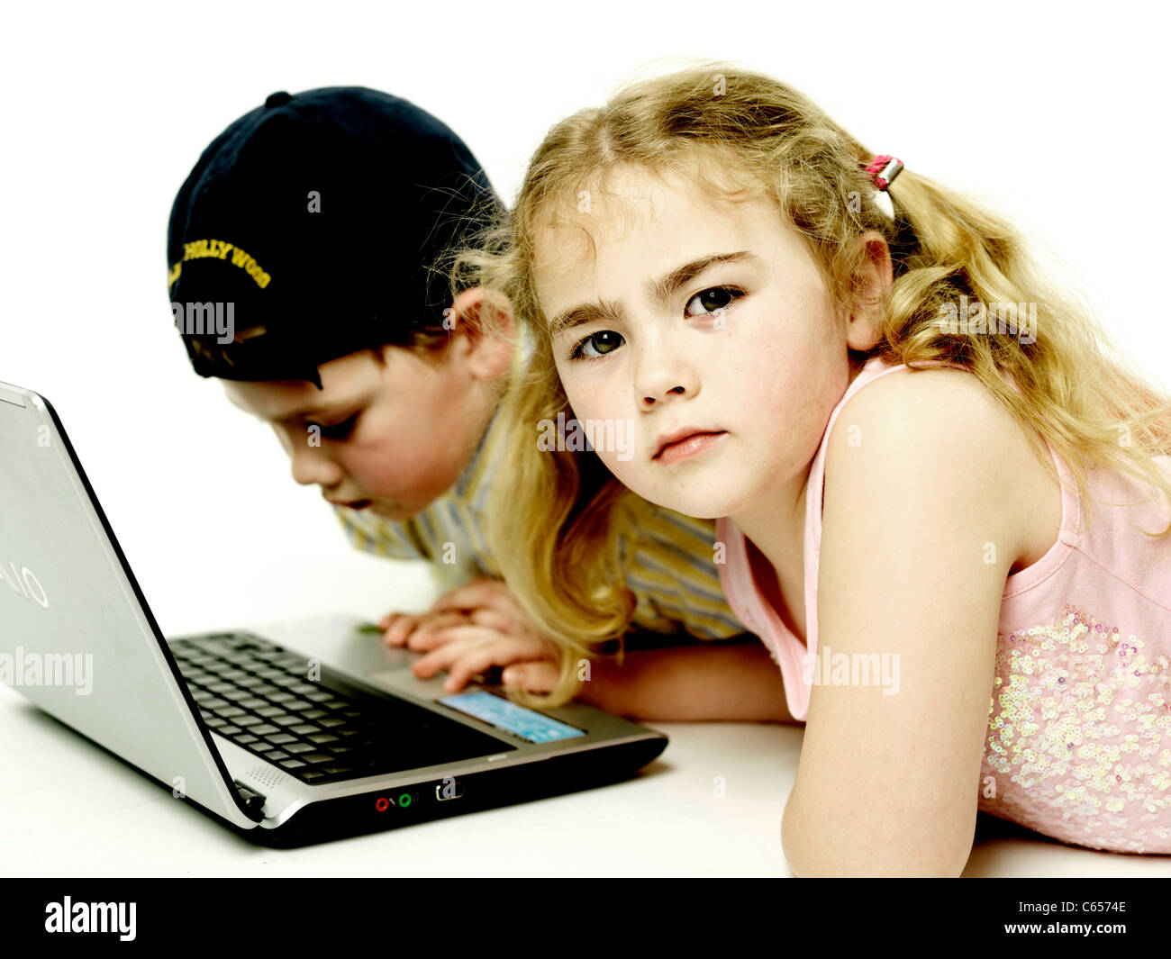 Brother And Sister With Laptop Computer. Models Released Stock Photo ...