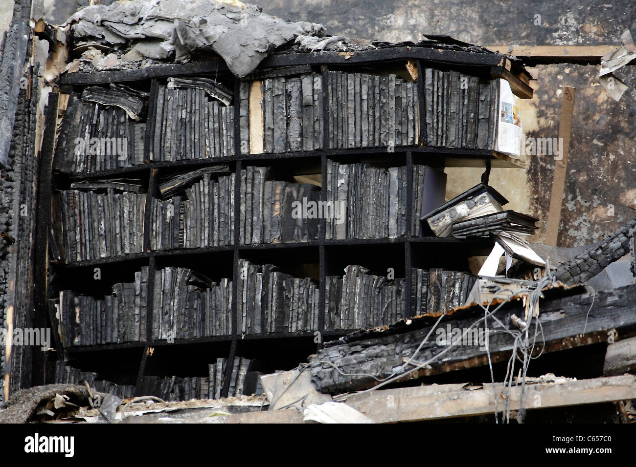 A charred bookcase from a destroyed family home in Tottenham Stock ...
