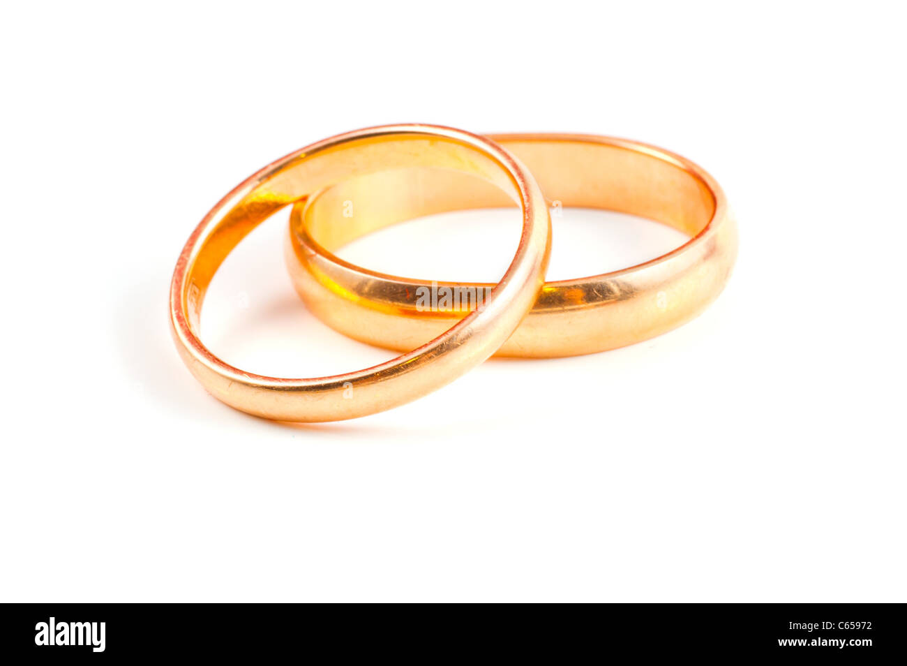 Wedding rings isolated on white background Stock Photo - Alamy