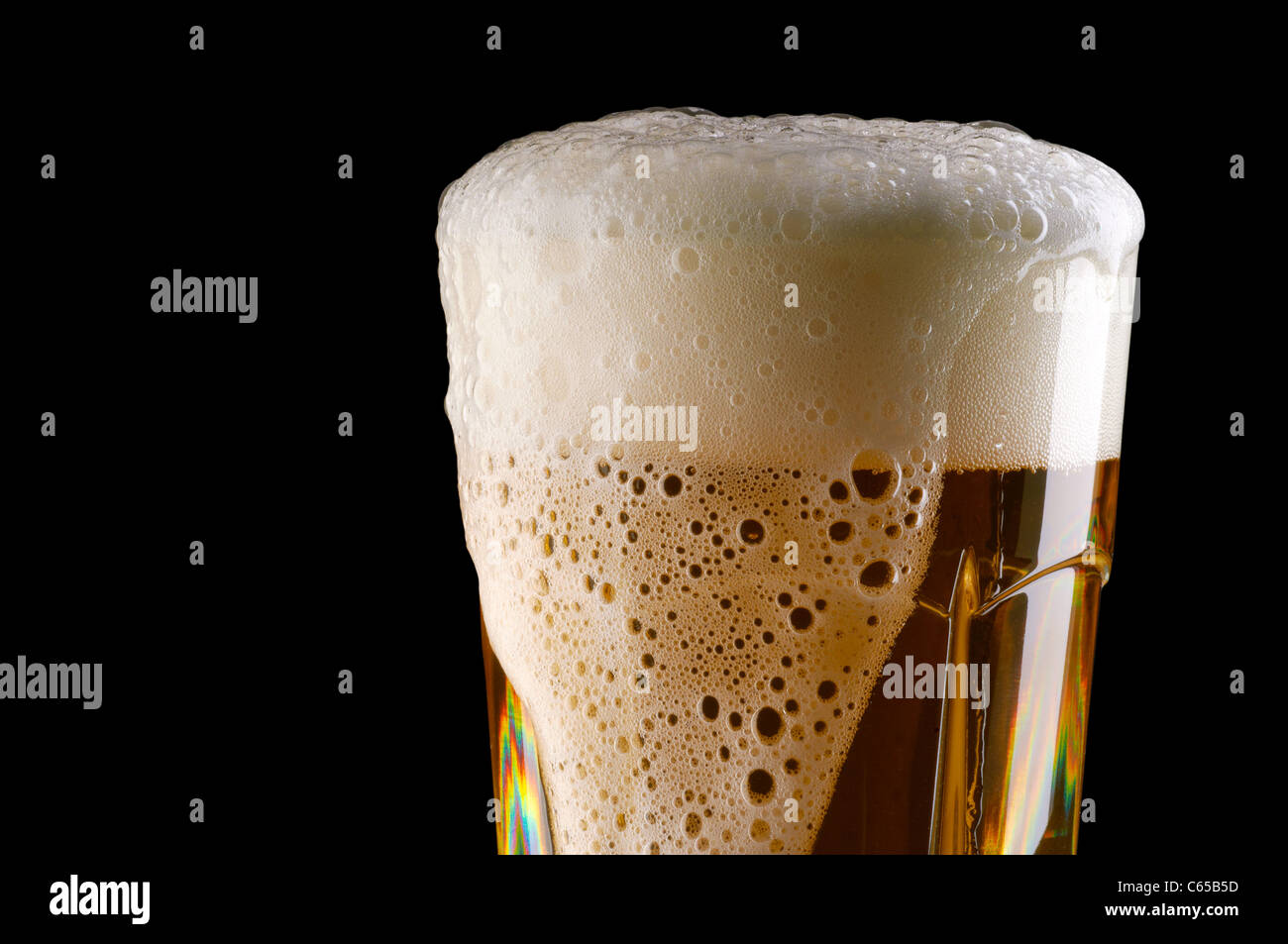 Overflowing glass of beer Stock Photo - Alamy