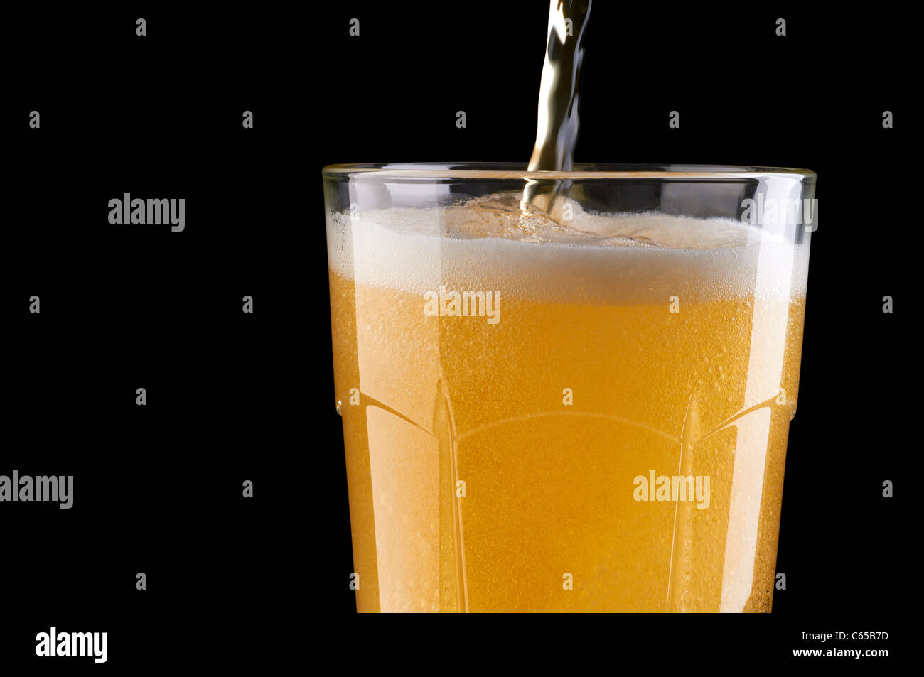 Filling beer glass Stock Photo - Alamy