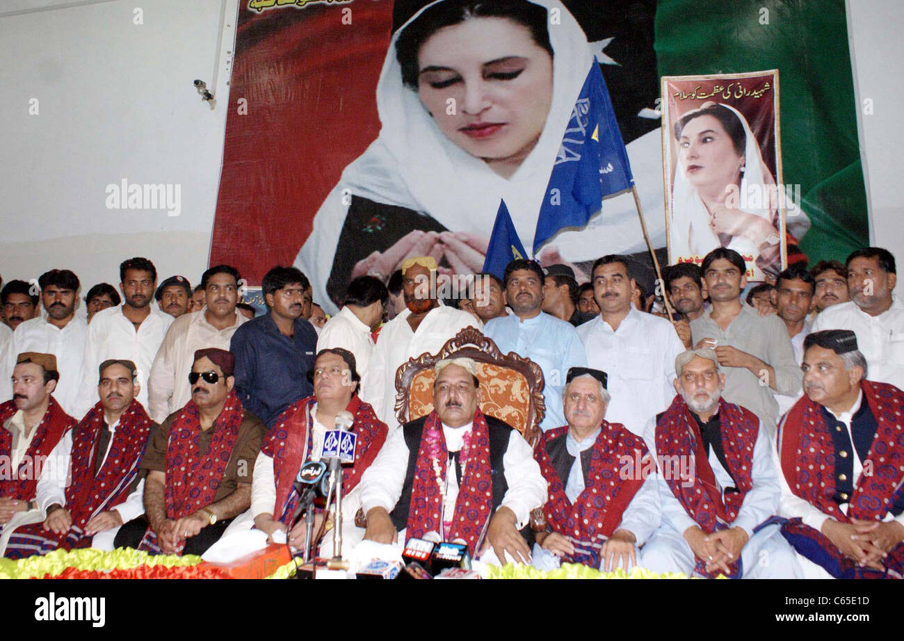 Azad Jammu Kashmir Prime Minister, Ch.Abdul Majeed sits on stage during ...