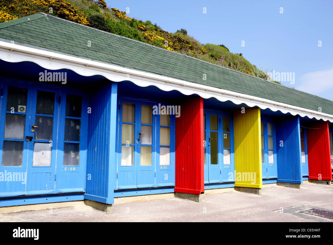 Beach beaches front hut huts row sea seafront seaside hi-res stock ...