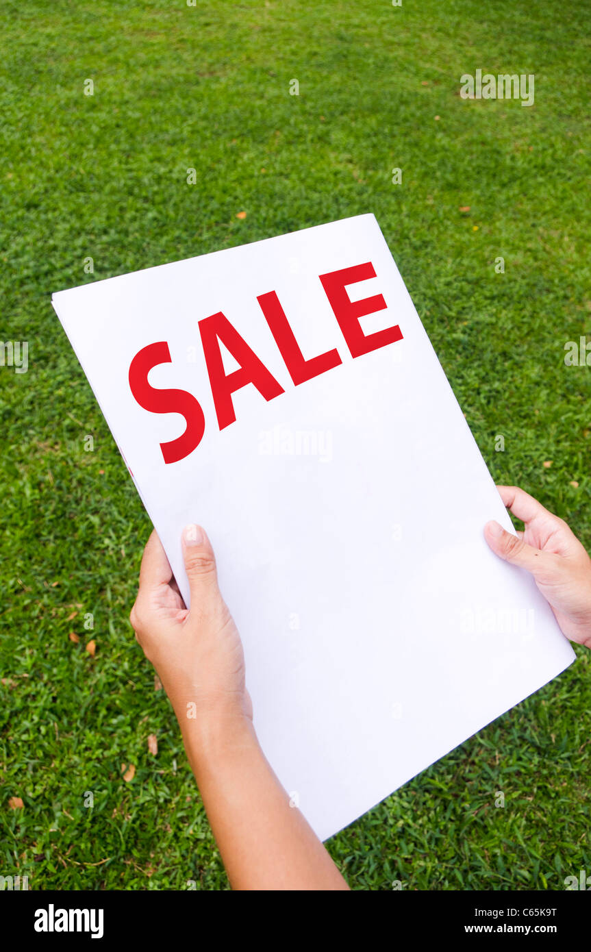 woman is reading a page with sale news Stock Photo - Alamy