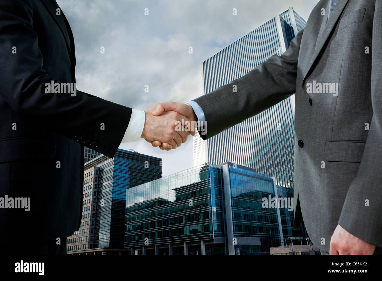 Businessmen shaking hands Stock Photo - Alamy