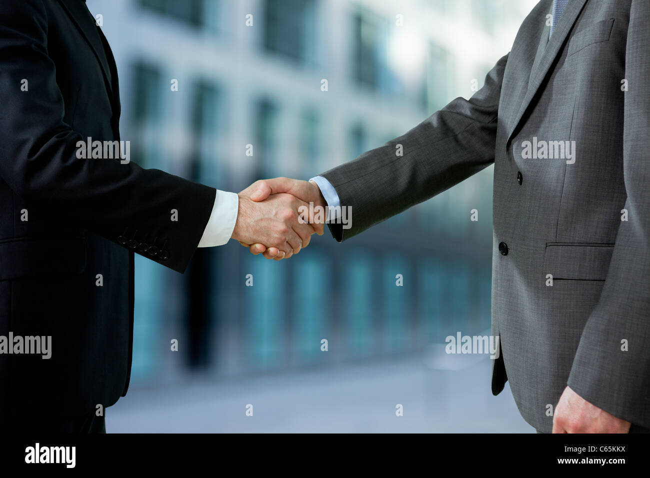 Businessmen shaking hands Stock Photo - Alamy