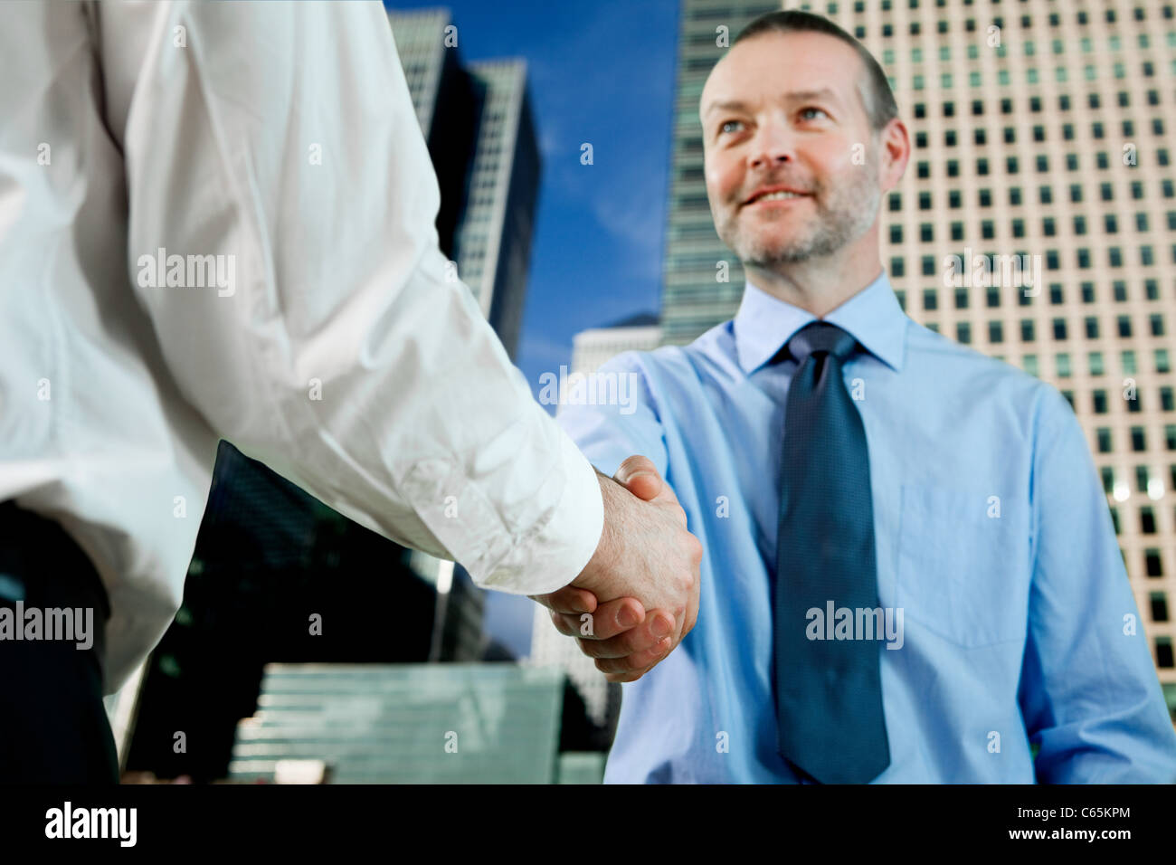 Businessmen shaking hands Stock Photo - Alamy