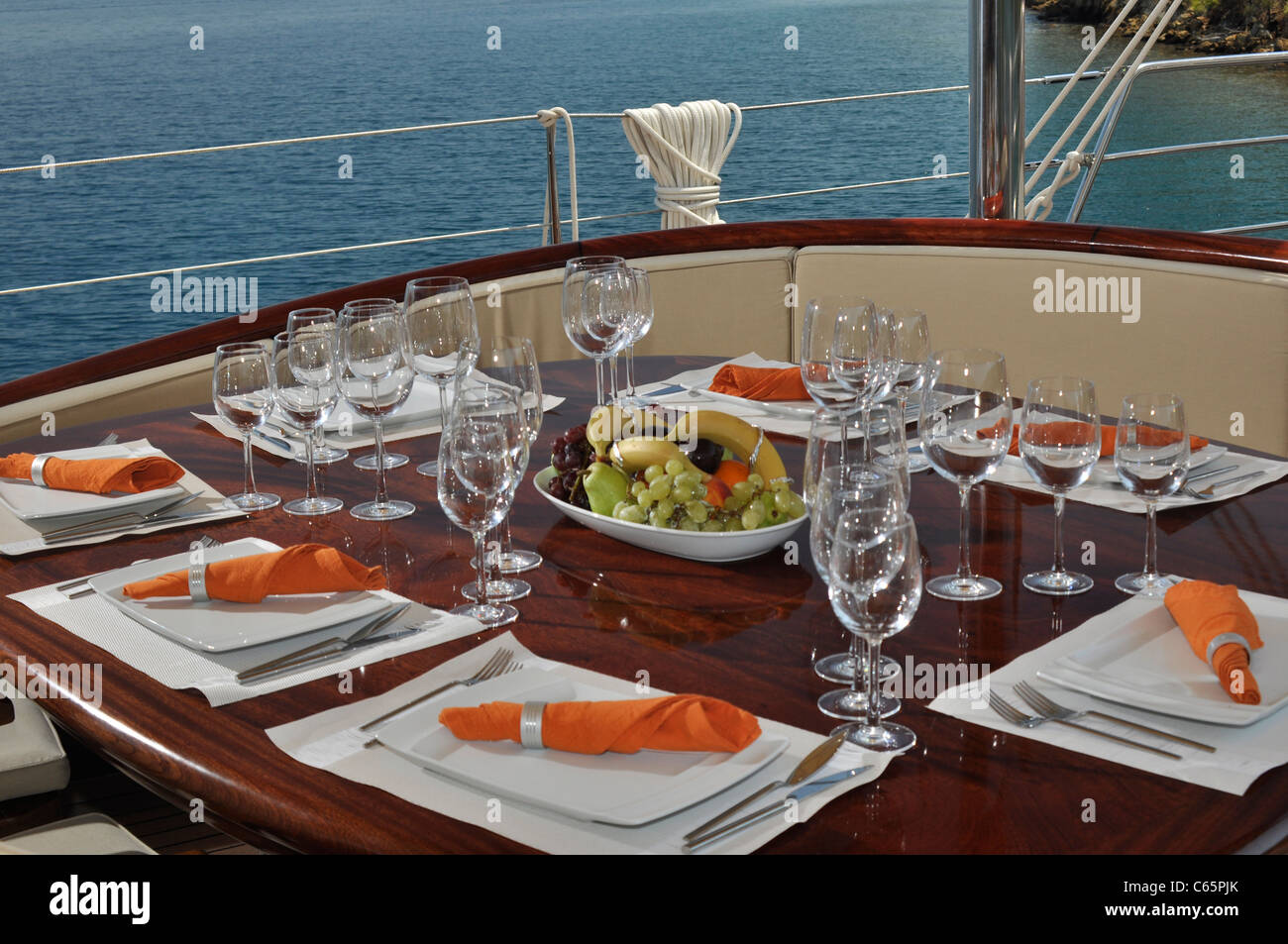 dinner table the deck of luxury sailboat Stock Photo - Alamy