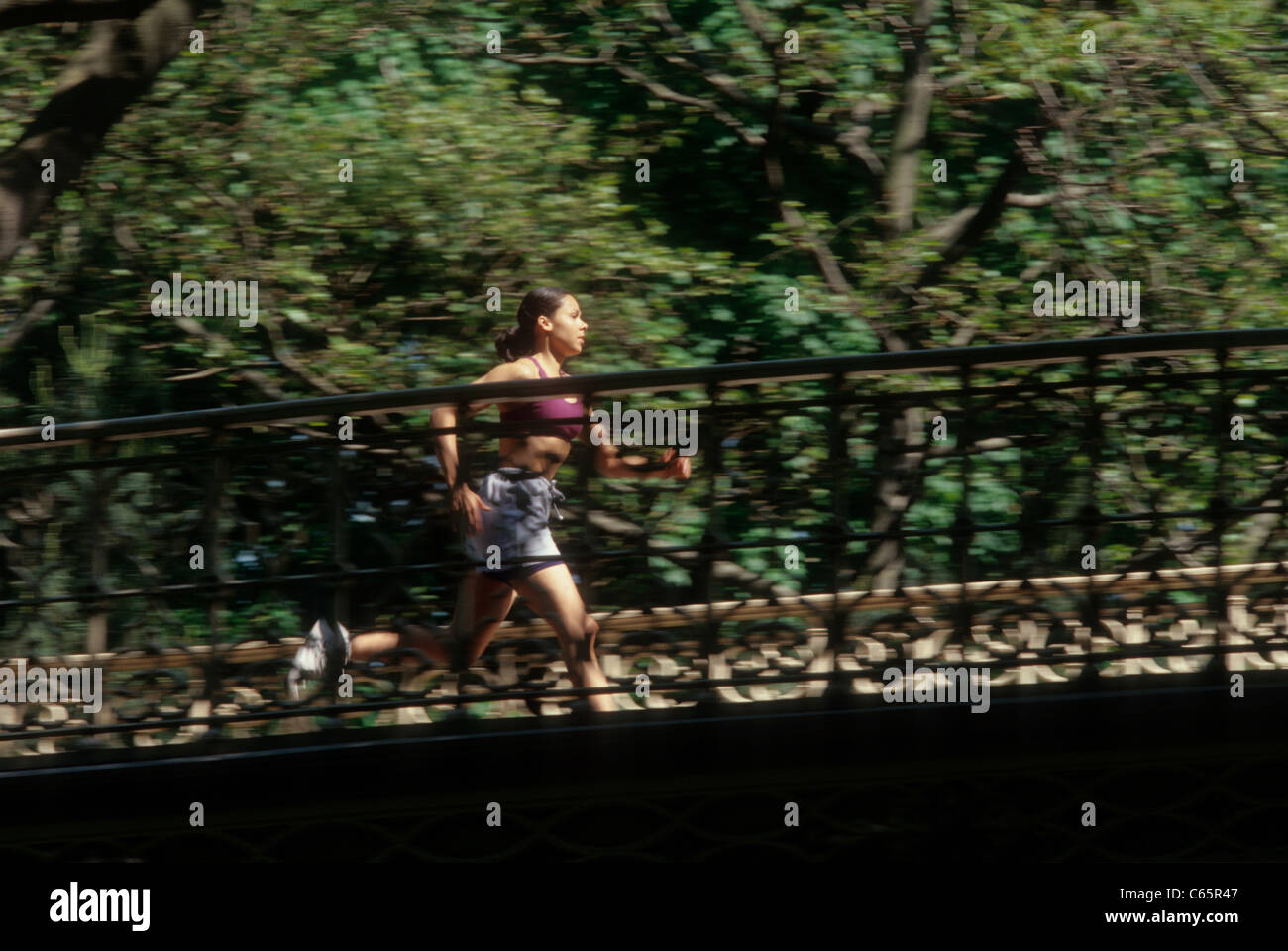 Hispanic woman running for exercise Stock Photo - Alamy