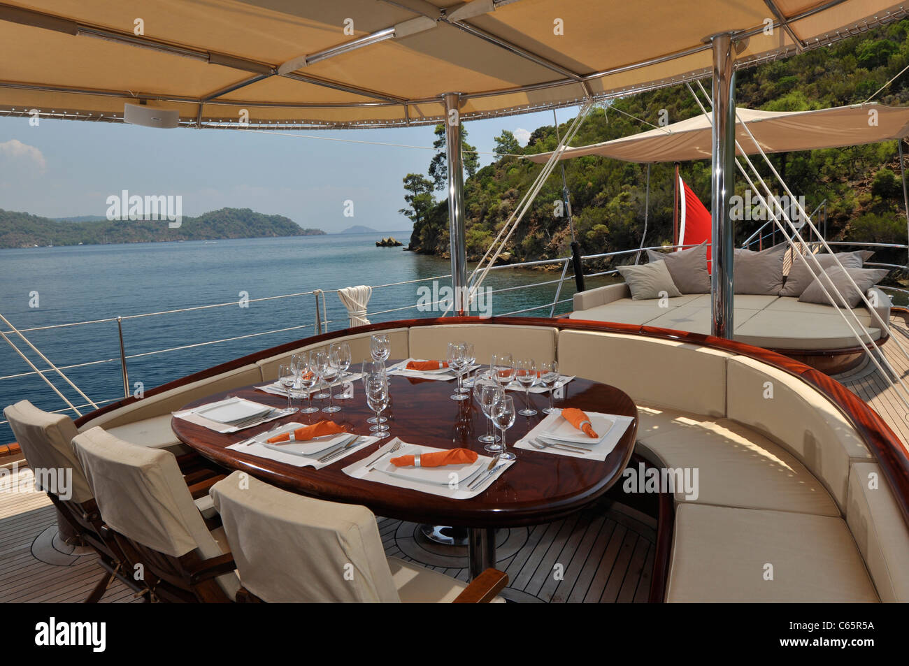 dinner table the deck of luxury sailboat Stock Photo - Alamy