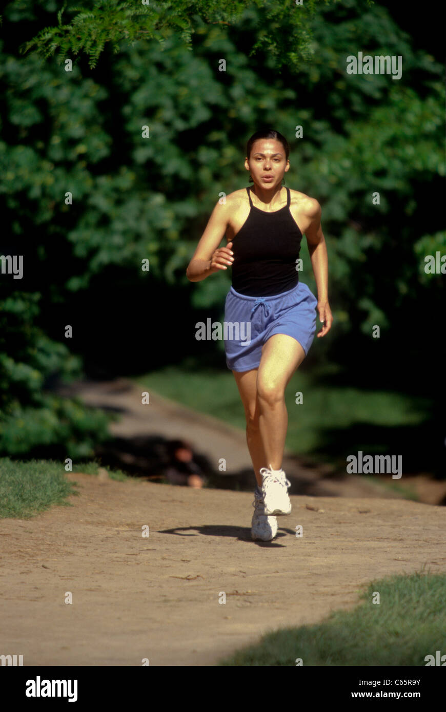 Hispanic woman running for exercise Stock Photo - Alamy