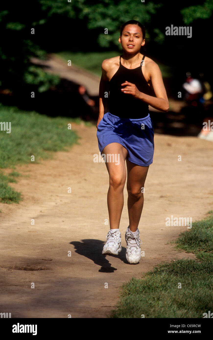 Hispanic woman running for exercise Stock Photo - Alamy