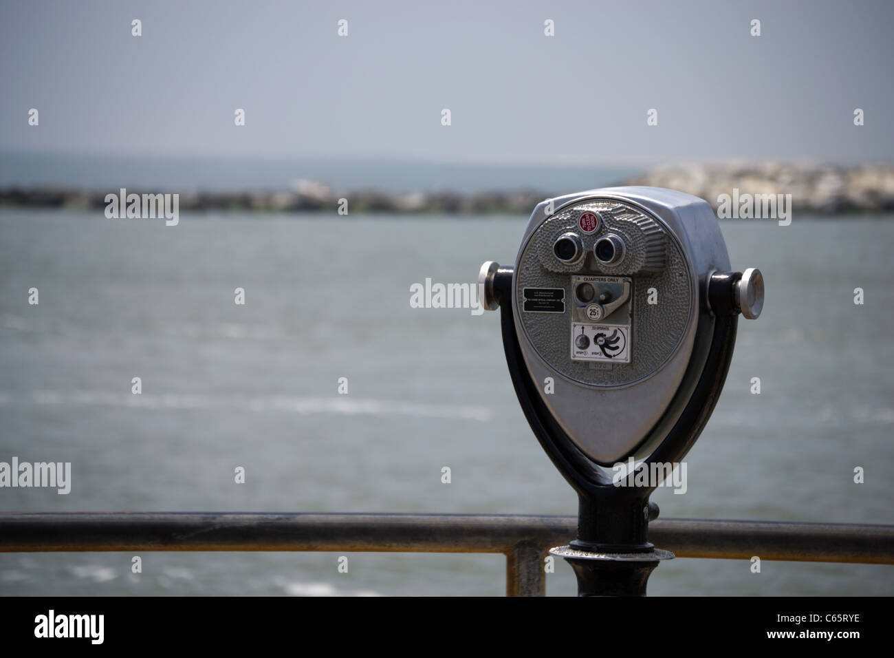 A viewing scope against an ocean background Stock Photo - Alamy