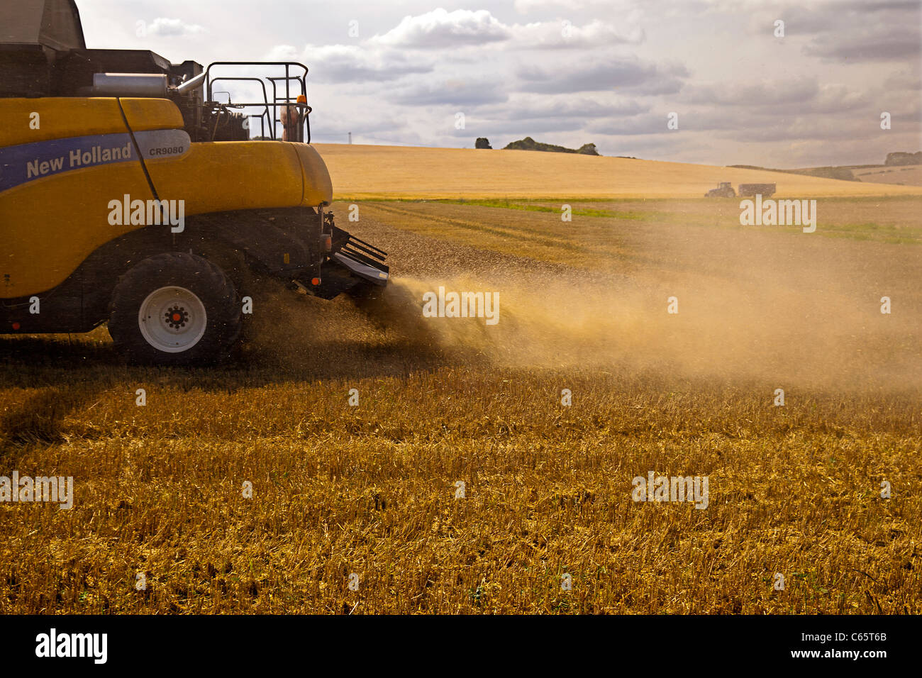 Wheat Dust exhausting from combine Harvester Stock Photo - Alamy