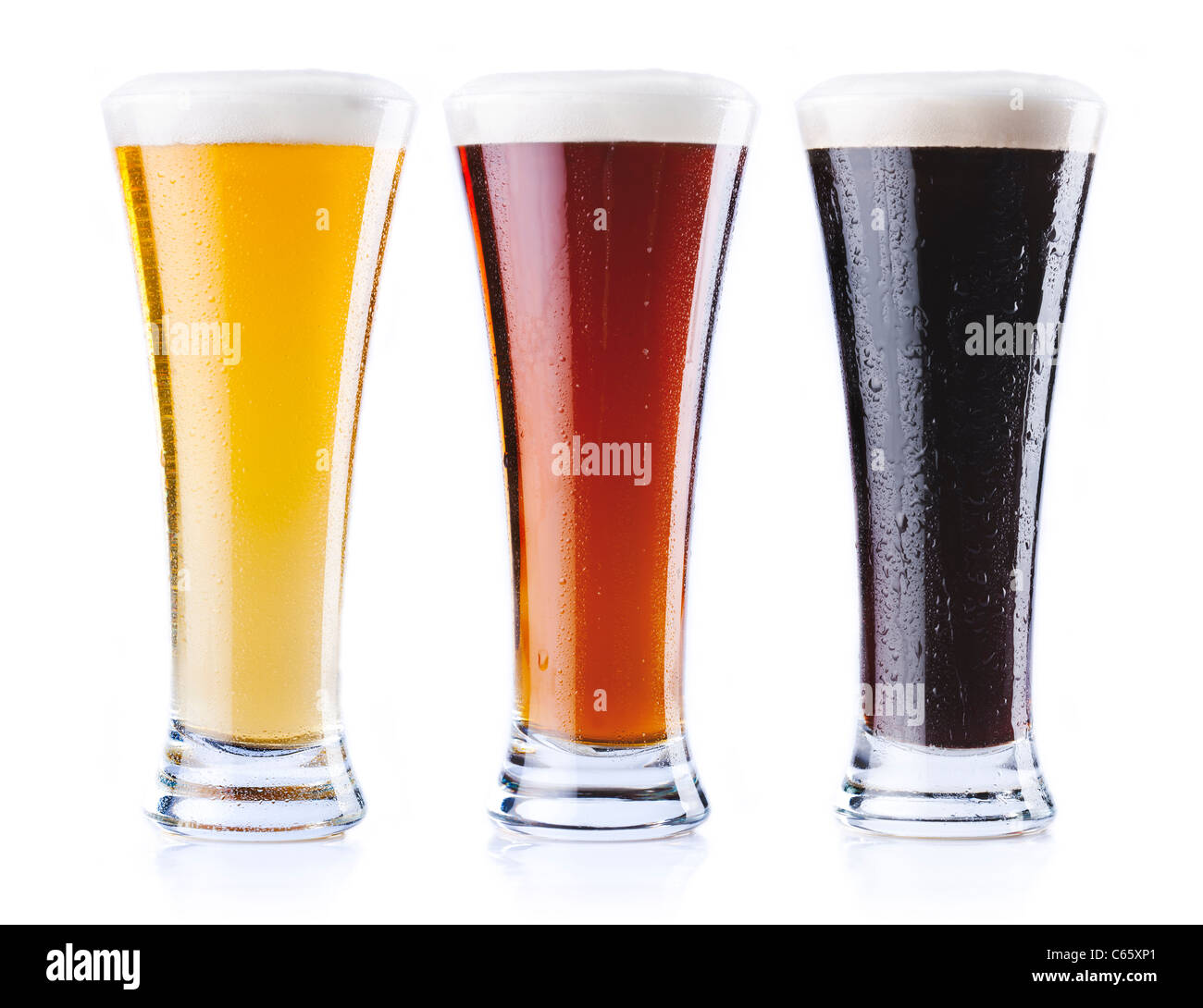 Three pints of beer, of three different colors, isolated on a white ...