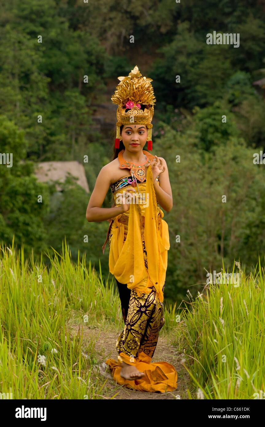 Traditional young female Balinese Dancer outdoors in field Stock Photo ...