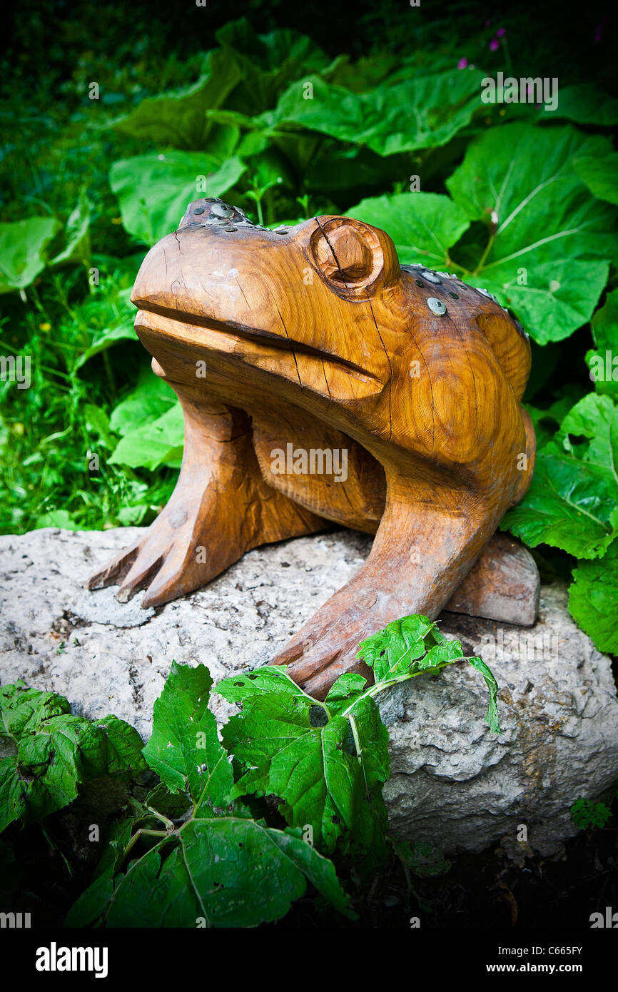 A carved frog sits on a leaf covered rock at Loggerheads Country Park ...