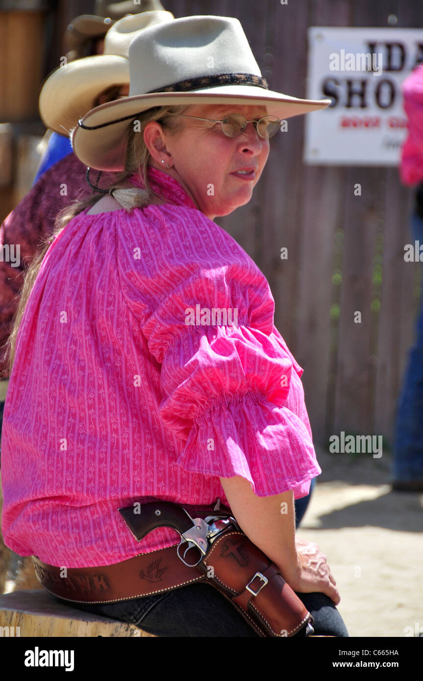 Woman contestant at a fast draw contest during Pioneer Day celebration ...
