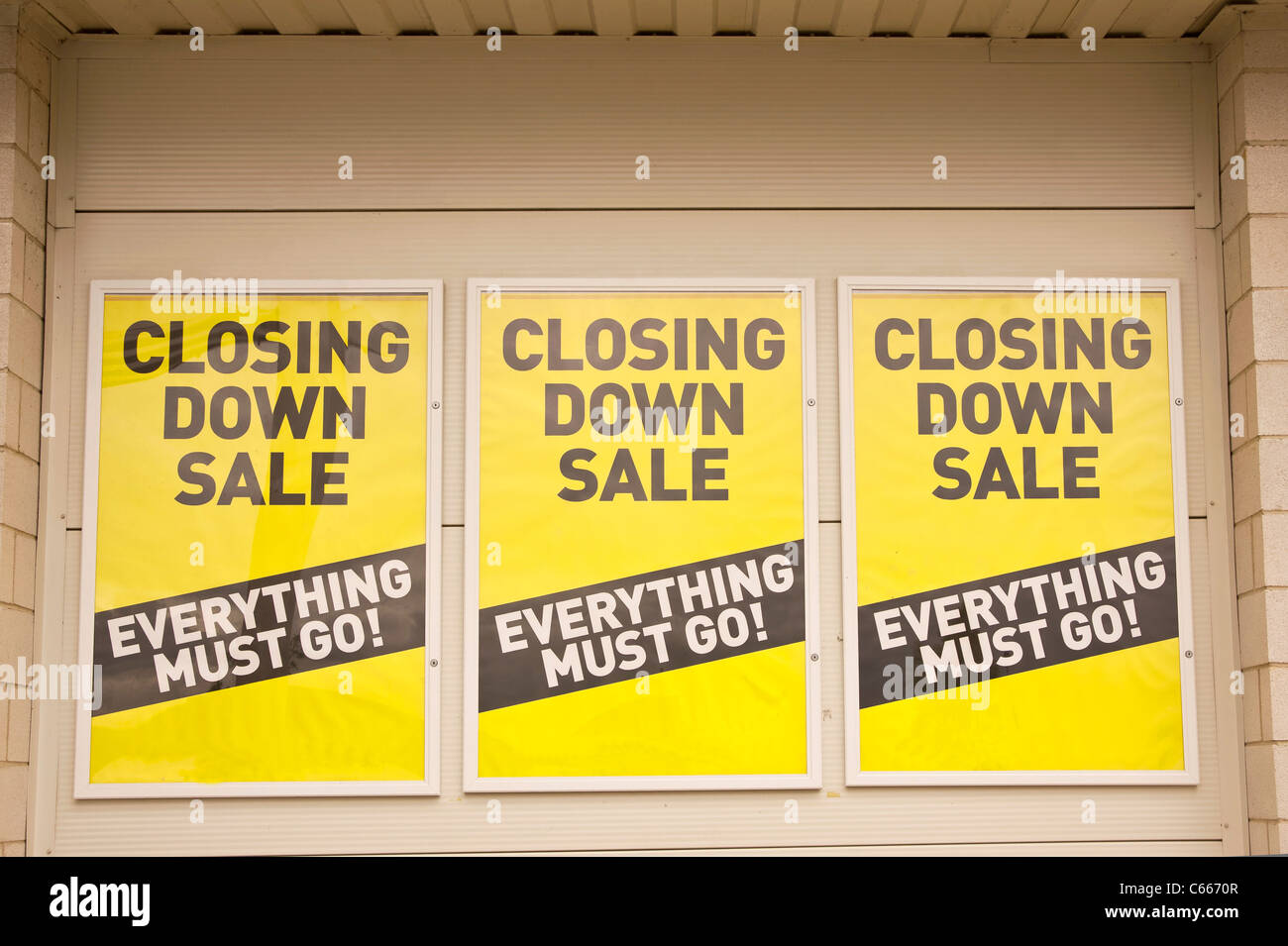 Closing down sales signs on the wall outside a shop Stock Photo - Alamy