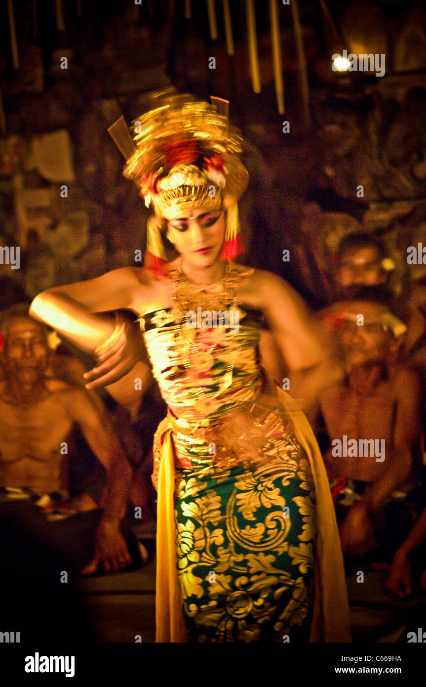 Blurred female Balinese dancer performing Fire dance in traditional ...