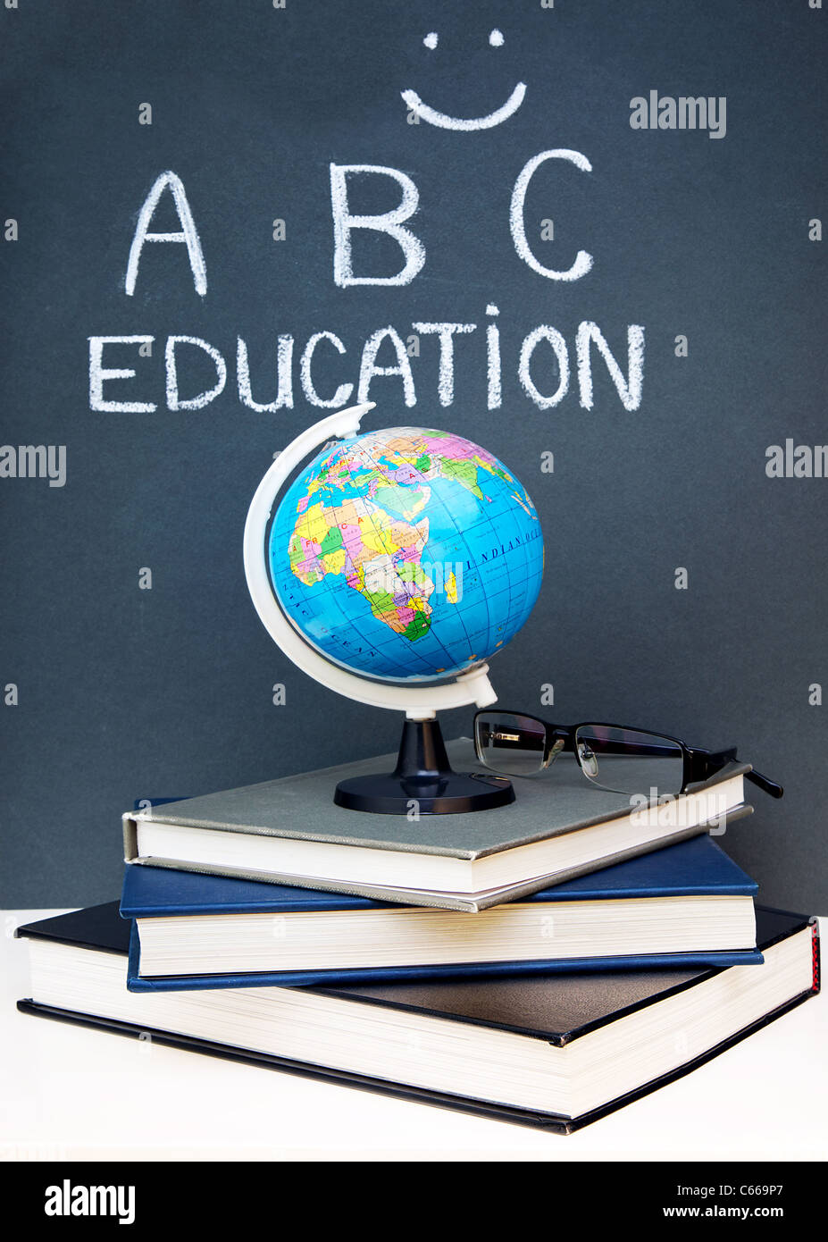 Study time concept, school objects in the classroom, books and globe on ...