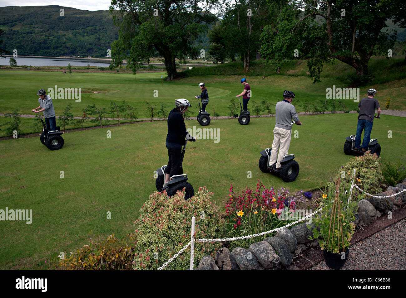 people learning to use a segway in scotland Stock Photo - Alamy